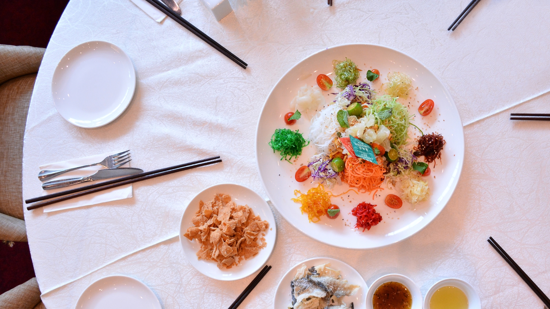 The Tradition of Lo Hei: Toss to Prosperity - HUONE Singapore